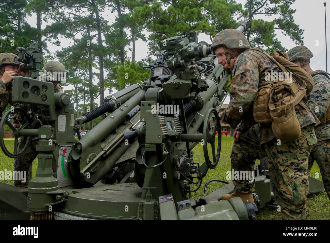 Marines practice aiming with the M777 Light Towed Howitzer during a ...