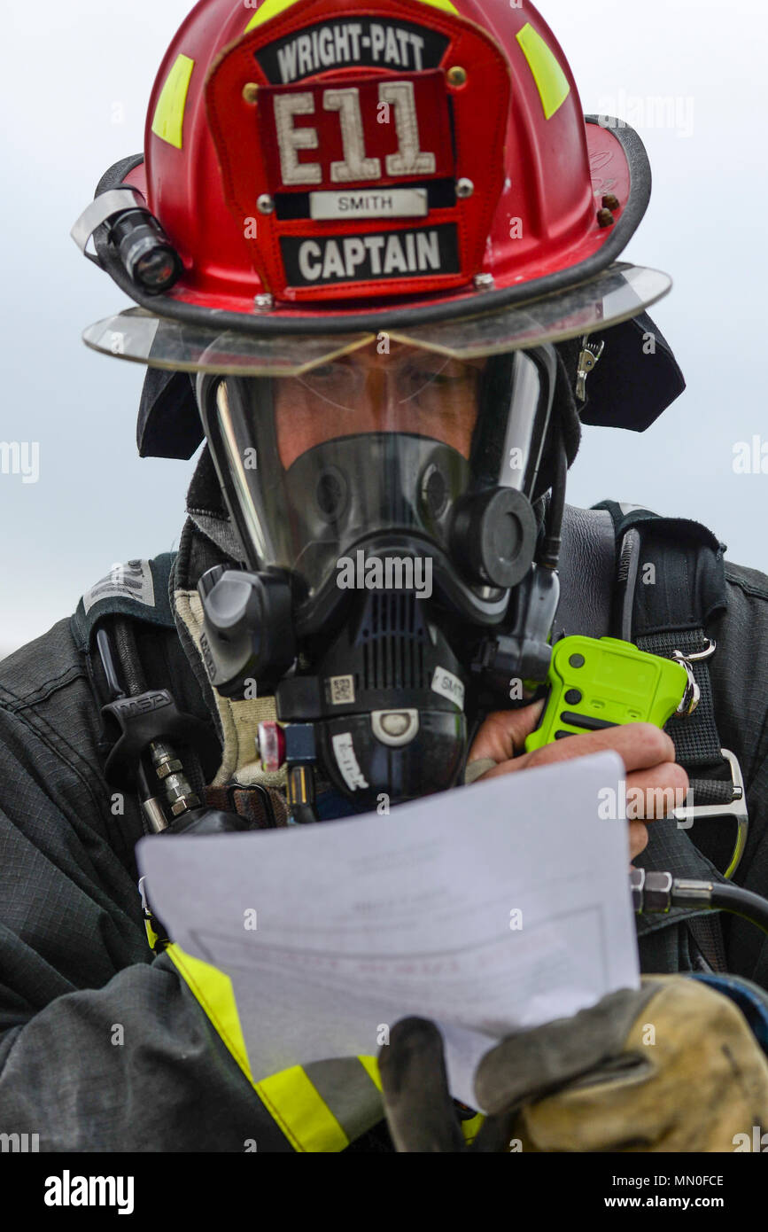 788th Civil Engineer Fire Department Capt. Matthew Smith, radios back ...