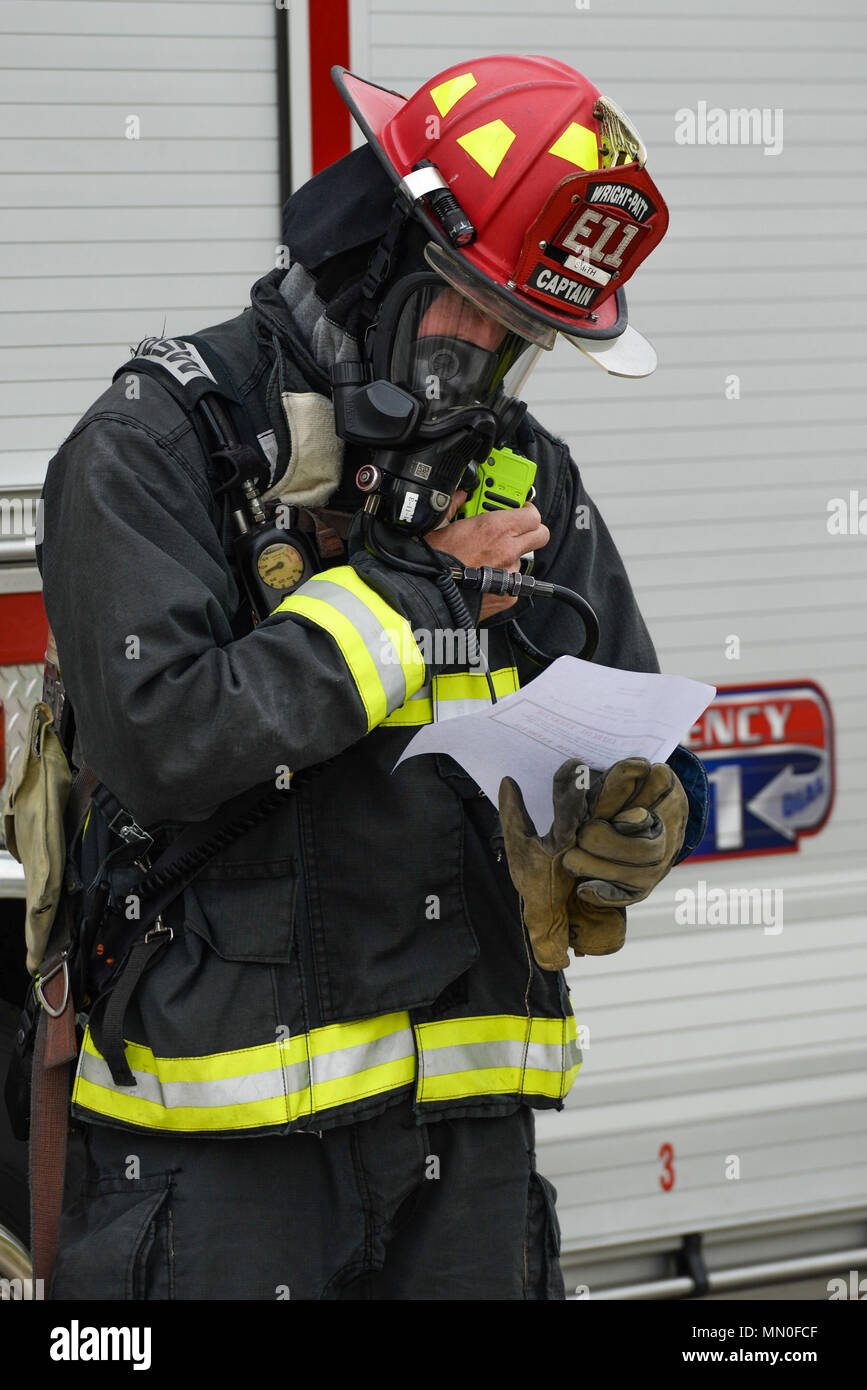 788th Civil Engineer Fire Department Capt. Matthew Smith, radios back ...