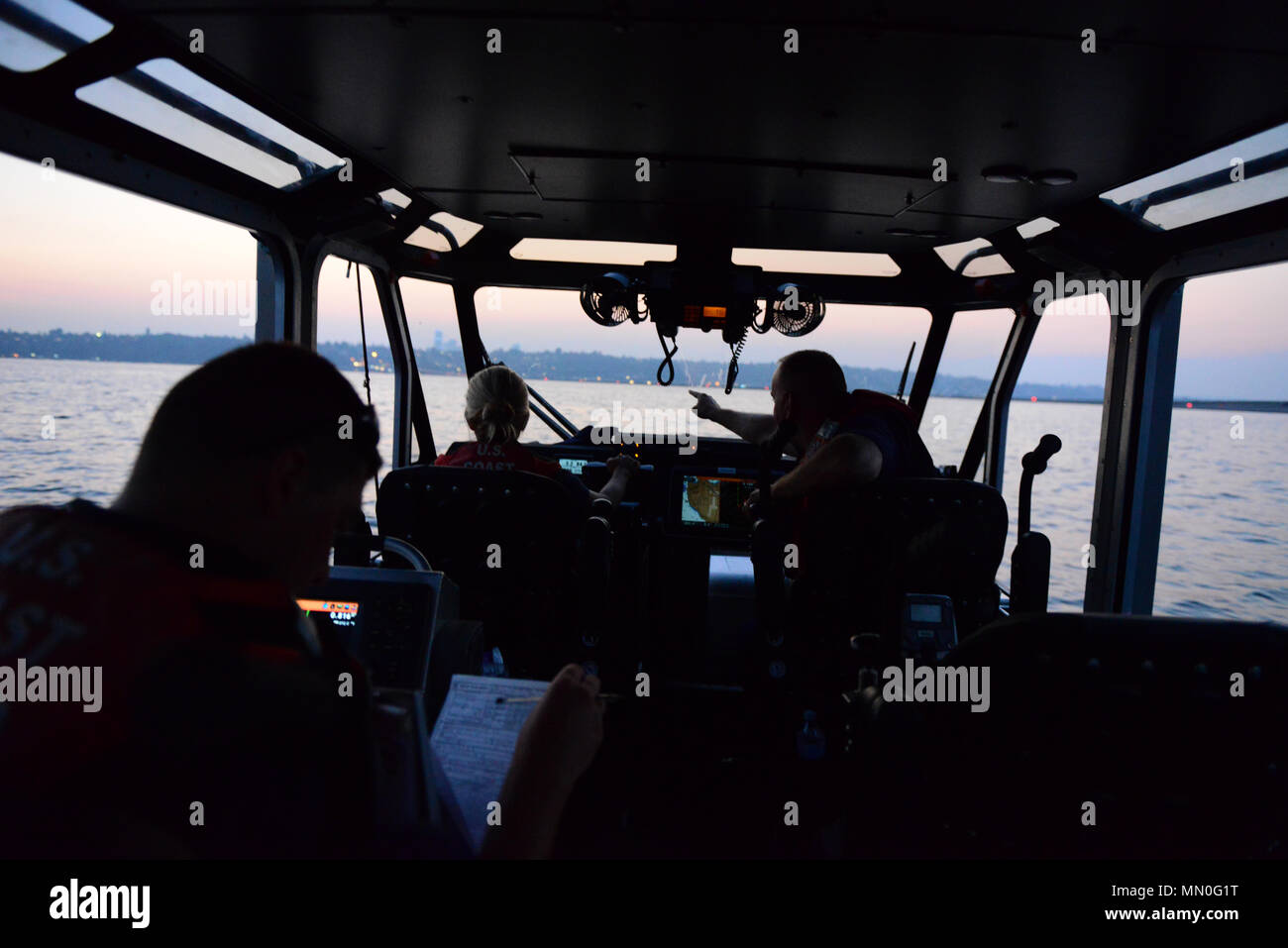 A boat crew from Coast Guard Station Seattle keep a watchful eye on ...