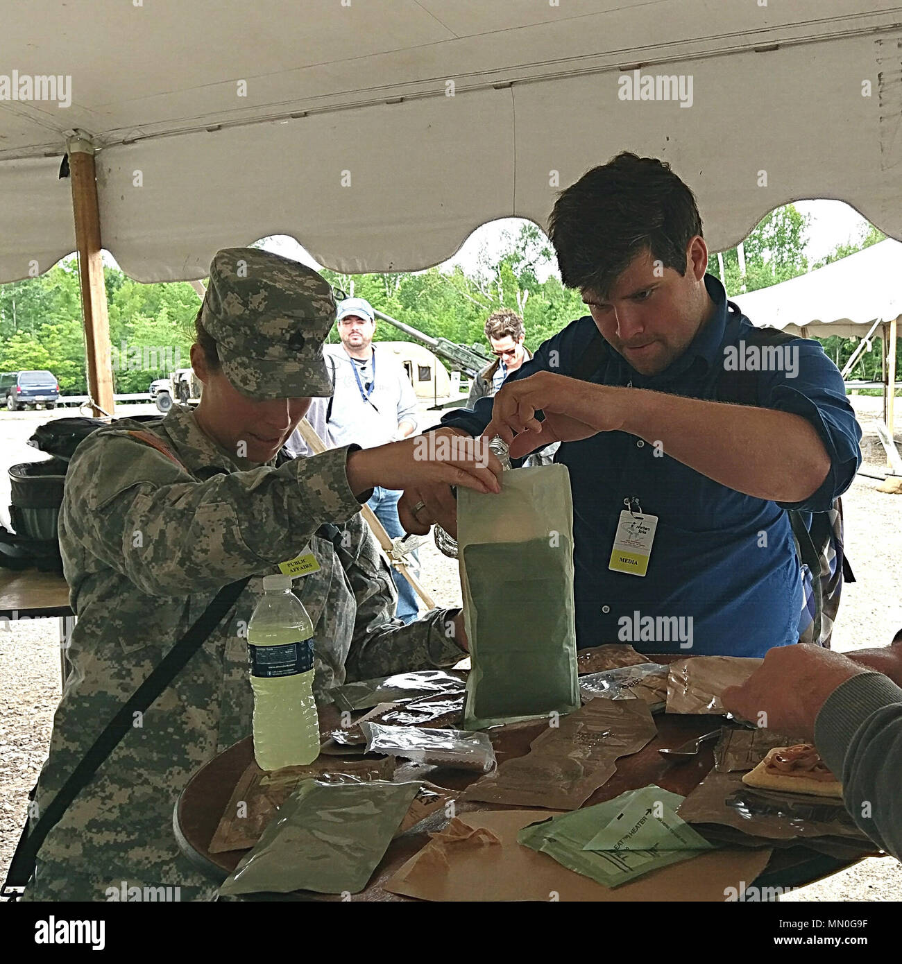 Staff Sgt. Anica Jankowski shows TV 9 and 10 reporter Cody Boyer how to ...
