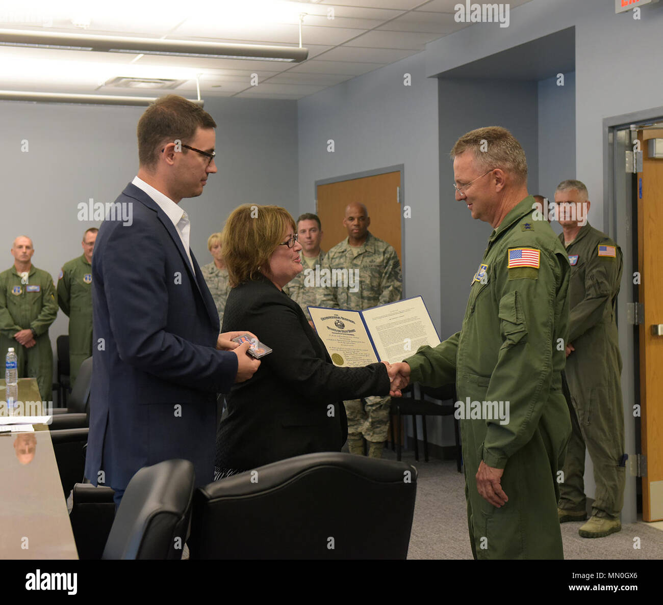 Maj. Gen. Anthony German (right), New York Adjutant General, presents ...