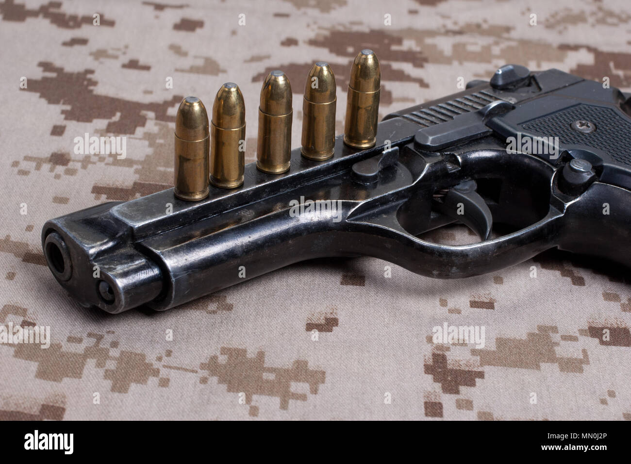Beretta hand gun on desert marines uniform Stock Photo - Alamy