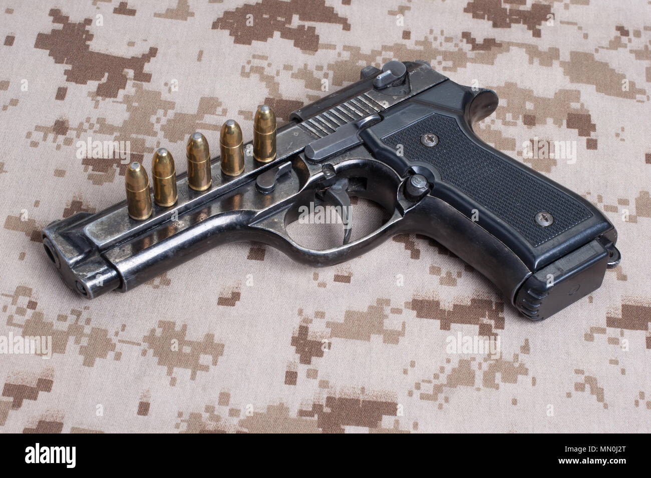 Beretta hand gun on desert marines uniform Stock Photo - Alamy