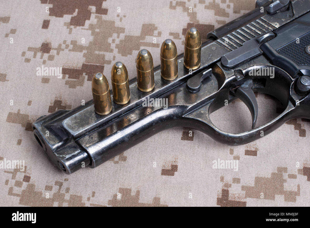 Beretta hand gun on desert marines uniform Stock Photo - Alamy