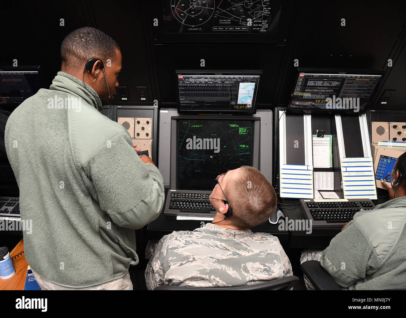 An air traffic controller with the 97th operations support squadron hi ...