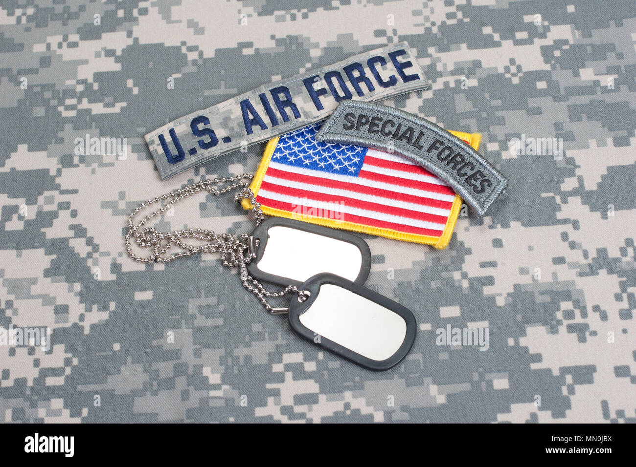 US ARMY special forces tab with blank dog tags on camouflage uniform ...