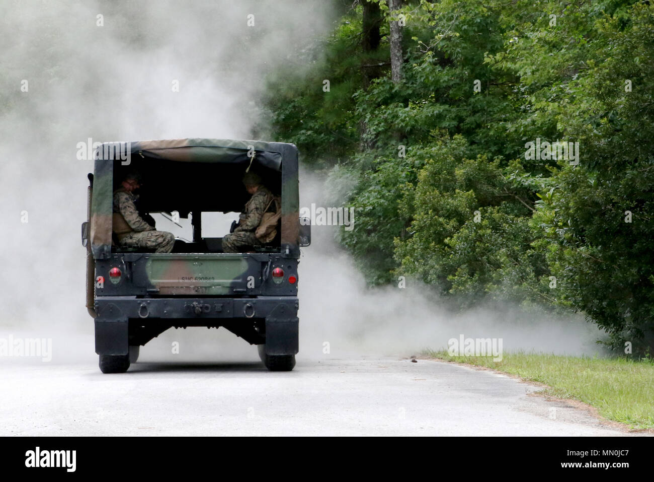 A Humvee full of Marines assigned to Marine Wing Support Squadron 271 ...
