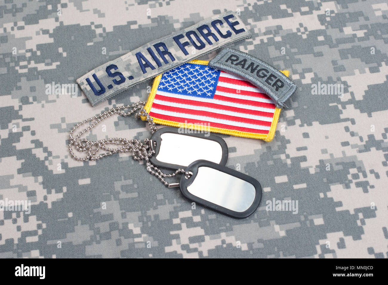 US ARMY ranger tab with blank dog tags on camouflage uniform Stock ...