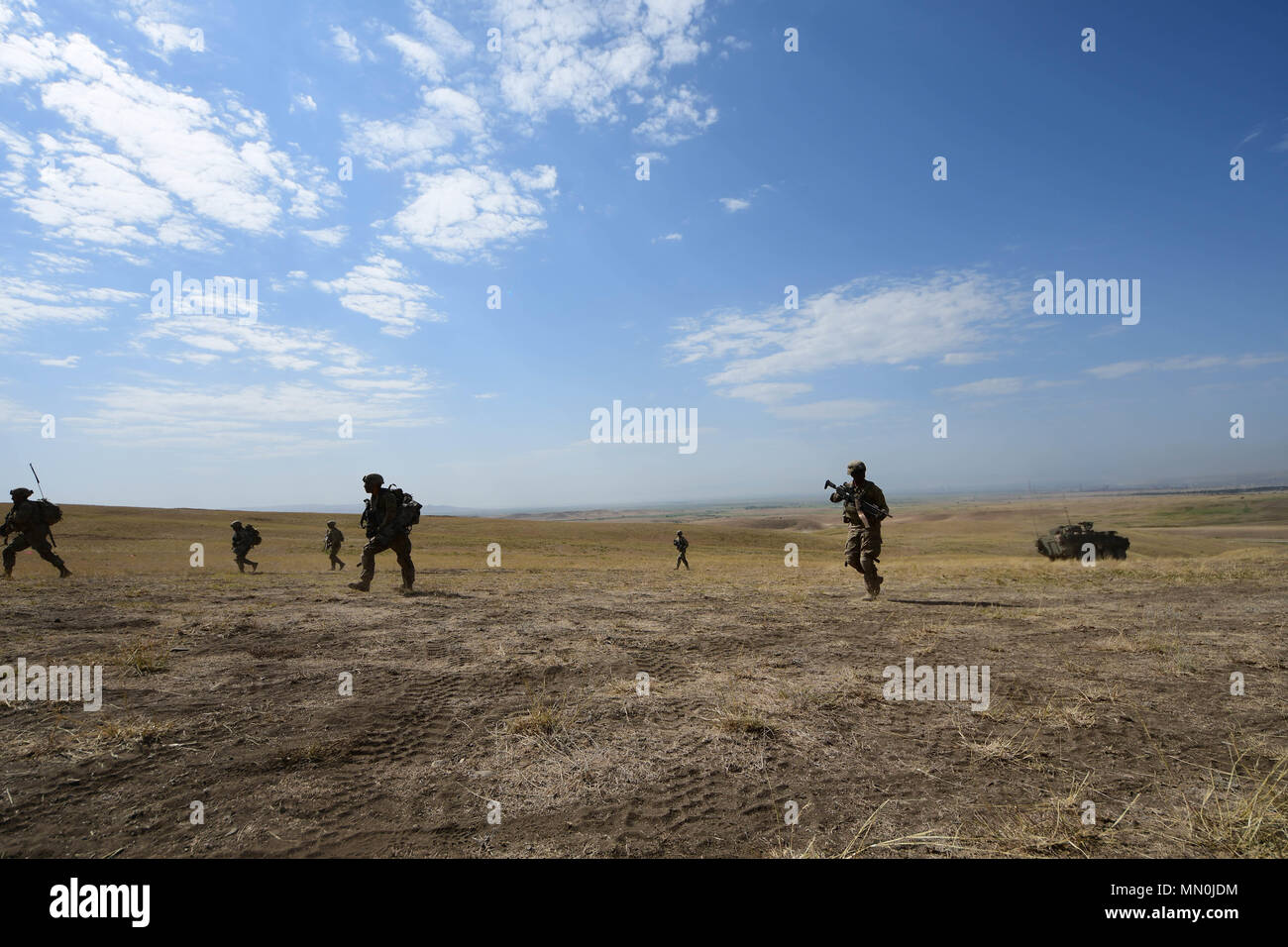 TBILISI, Georgia -- Soldiers from 2nd Cavalry Regiment move toward a ...