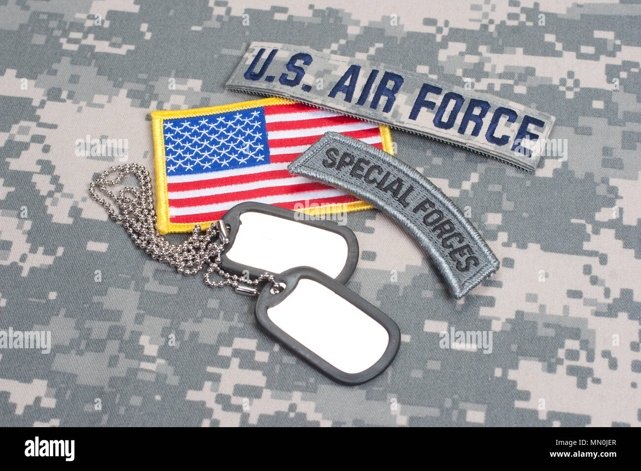 US ARMY special forces tab with blank dog tags on camouflage uniform ...