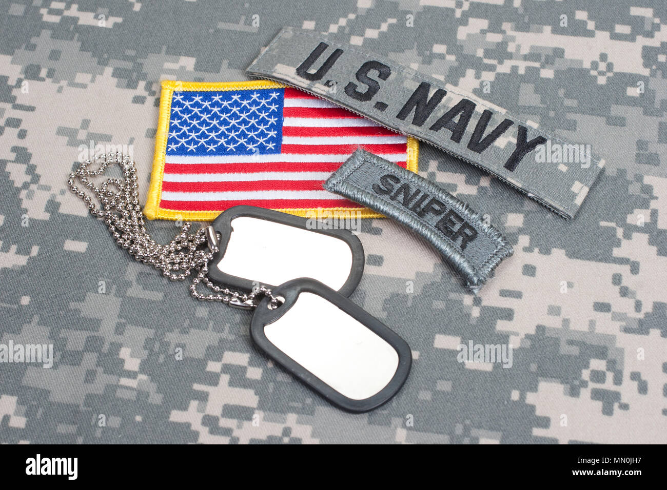 US ARMY sniper tab with blank dog tags on camouflage uniform Stock ...