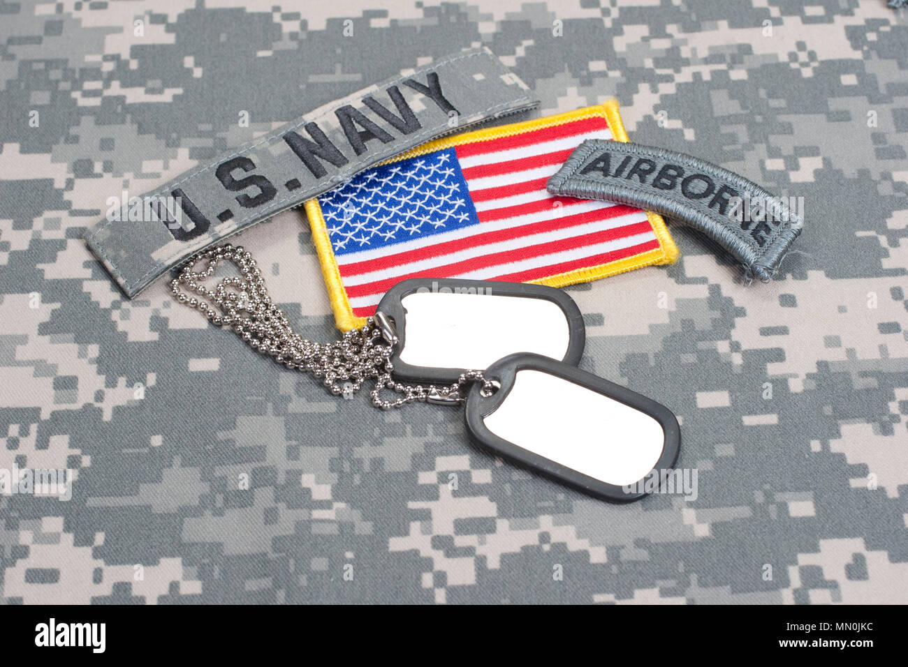 US ARMY airborne tab with blank dog tags on camouflage uniform Stock ...