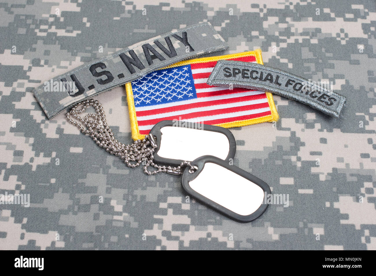 US ARMY special forces tab with blank dog tags on camouflage uniform ...