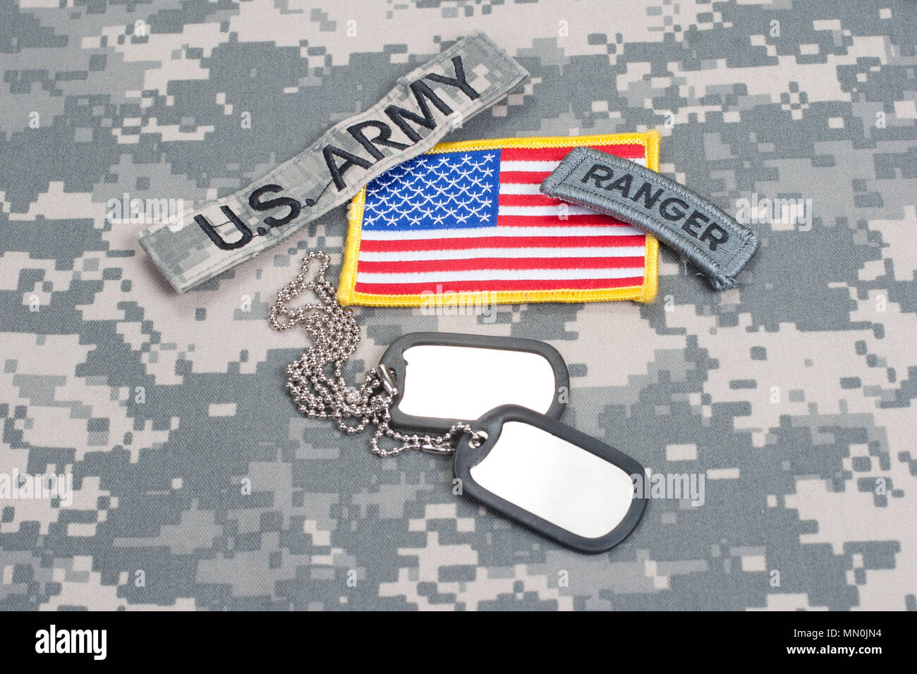 US ARMY ranger tab with blank dog tags on camouflage uniform Stock ...