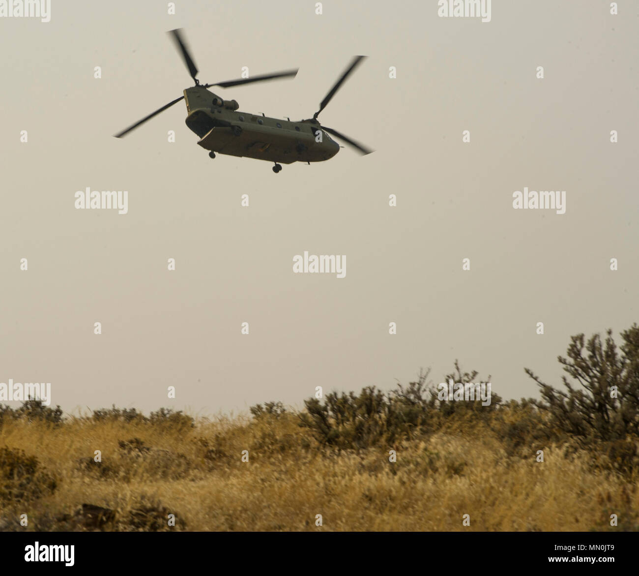 A U.S. Army CH-47 Chinook leaves an extraction point after picking up ...