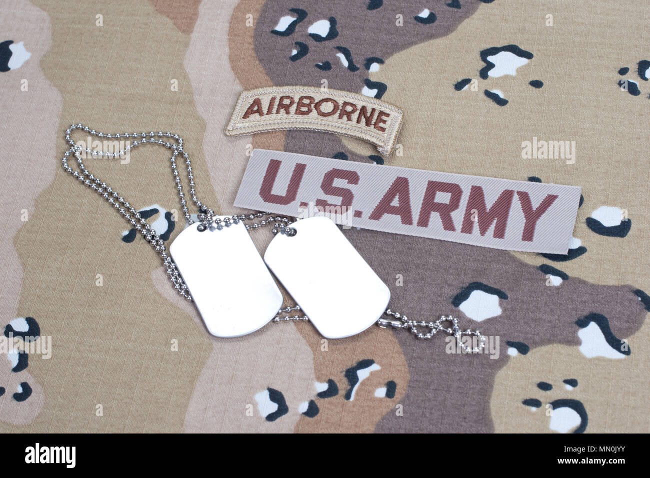 US ARMY airborne tab with blank dog tags on camouflage uniform Stock ...