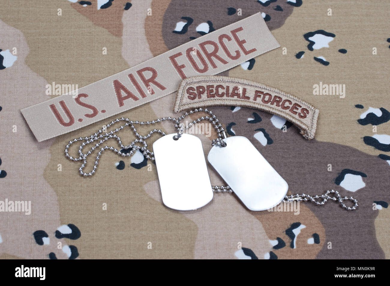 US ARMY special forces tab with blank dog tags on camouflage uniform ...