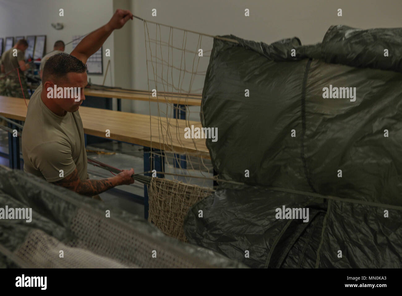 U.S. Army parachute riggers, from the 165th Quartermaster Company ...