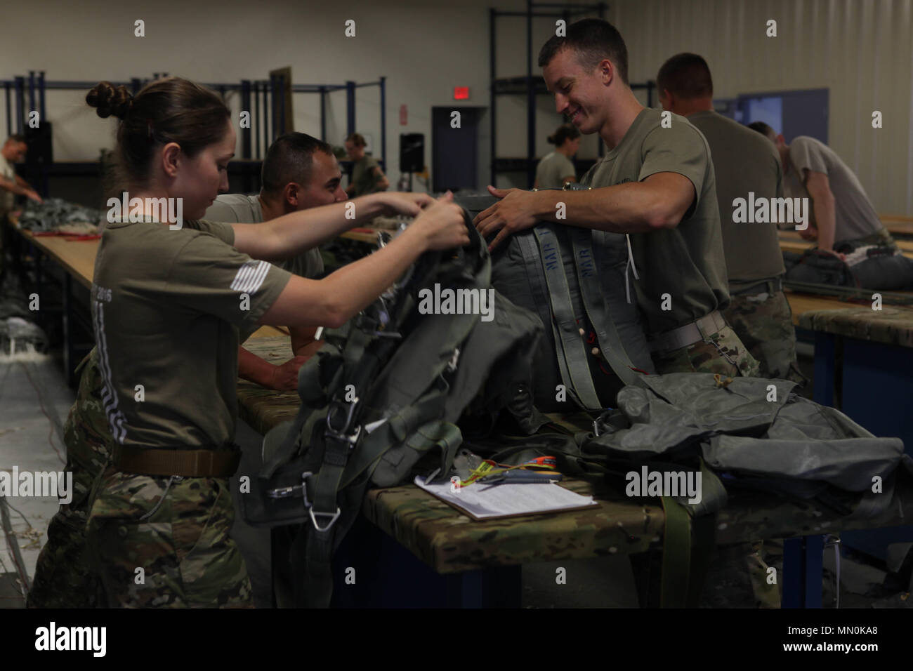 U.S. Army parachute riggers, from the 165th Quartermaster Company ...
