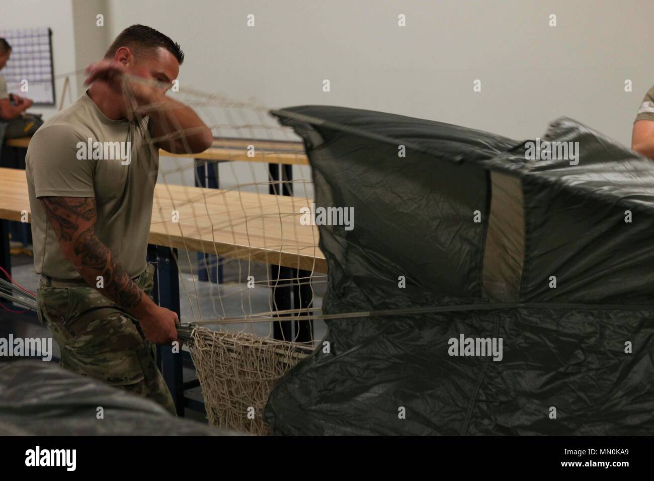 U.S. Army parachute riggers, from the 165th Quartermaster Company ...