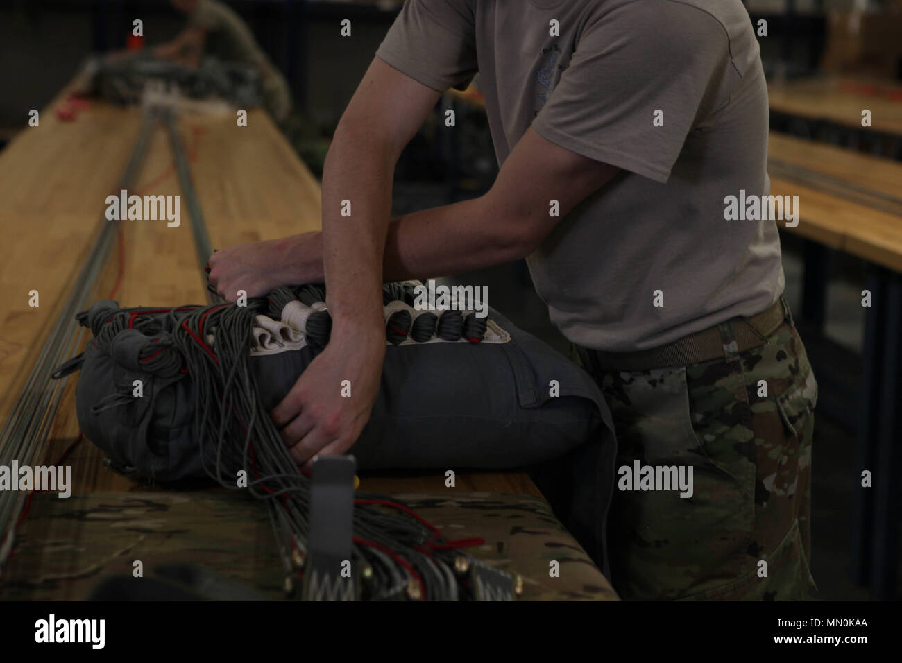 U.S. Army parachute rigger, from the 165th Quartermaster Company ...