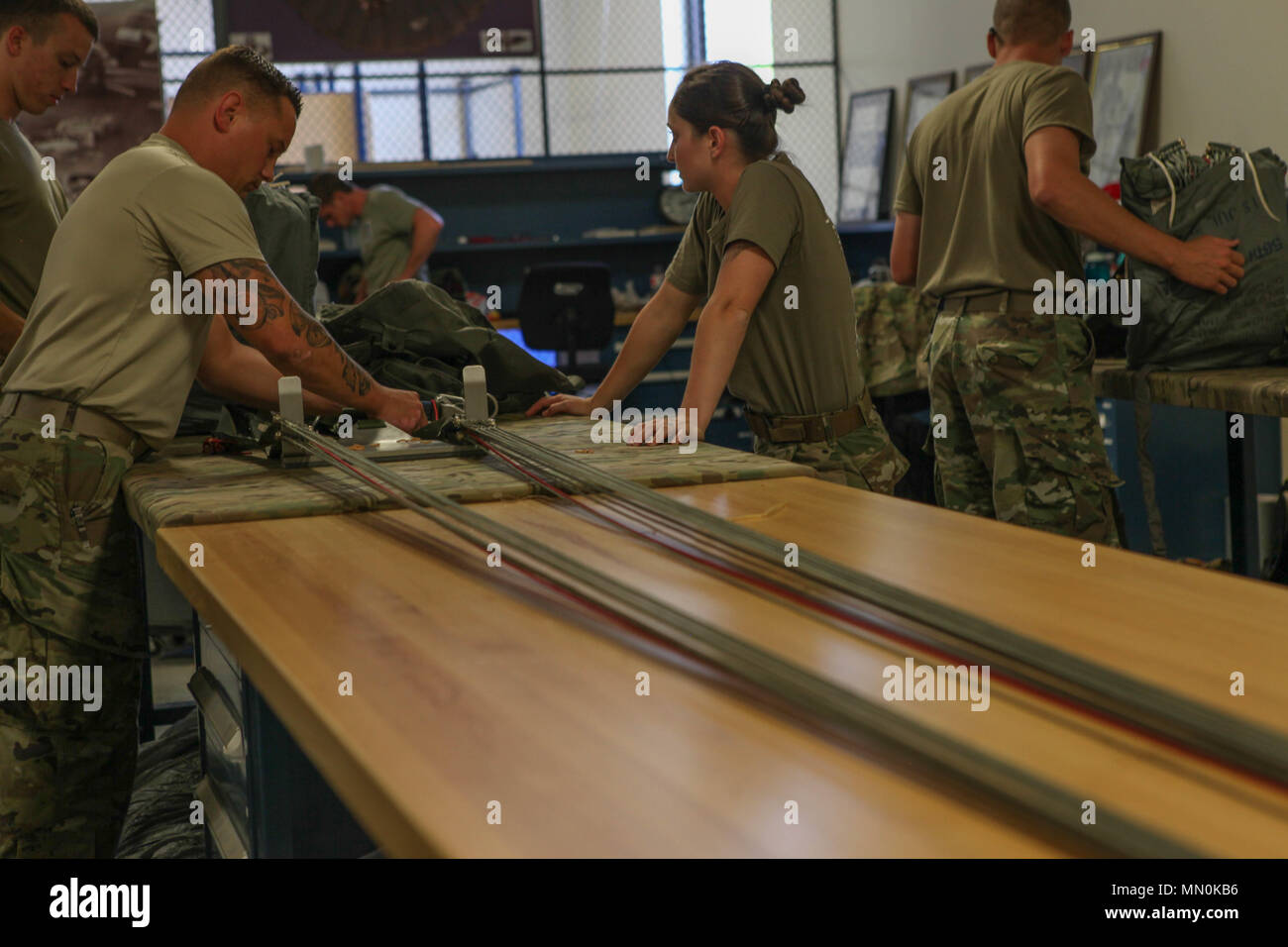U.S. Army parachute riggers, from the 165th Quartermaster Company ...