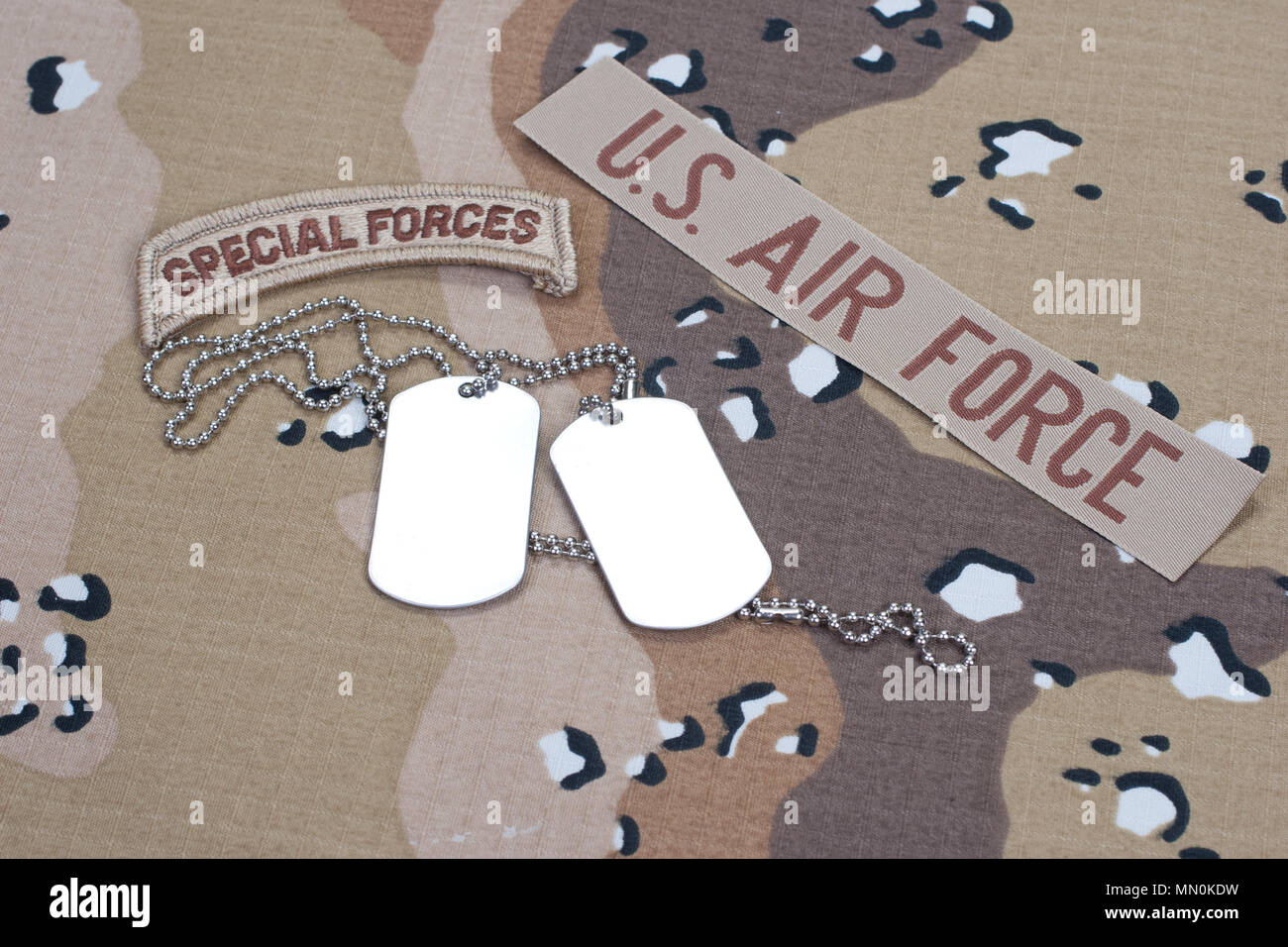 US ARMY special forces tab with blank dog tags on camouflage uniform ...