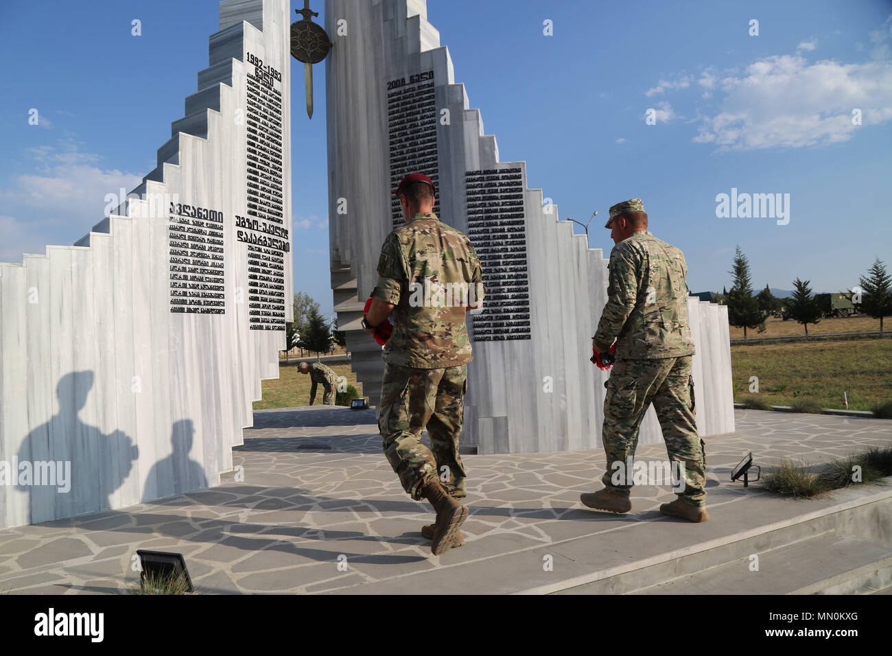 U.S. Army Maj. Mark Bush, 2nd Parachute Regiment, lays a wreath with ...