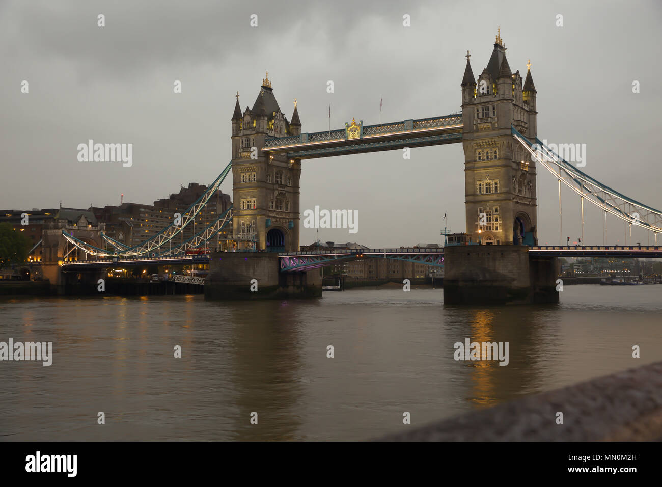 Tower Bridge lifting up early evening to allow a boat to pass ...
