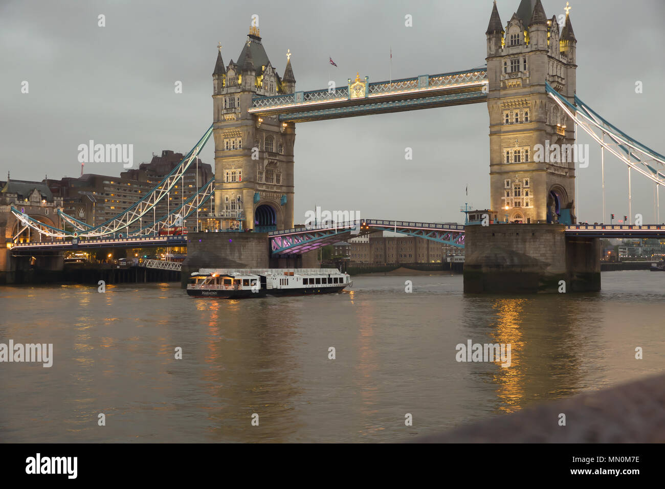 Tower Bridge lifting up early evening to allow a boat to pass ...