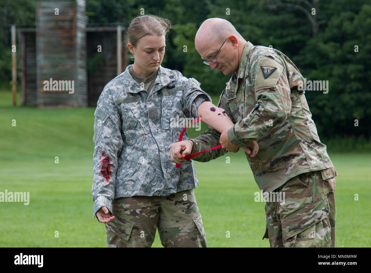 U.S. Army Staff Sgt. Scott Sprano and Pfc. Mary Charnley, medics with ...