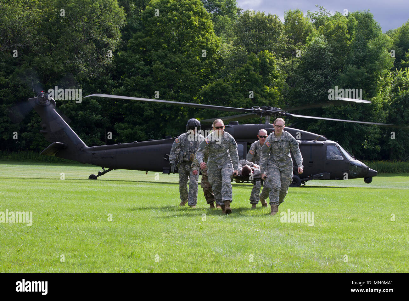 U.S. Army Staff Sgt. Stephen Trala, left, flight medic, Charlie Company ...