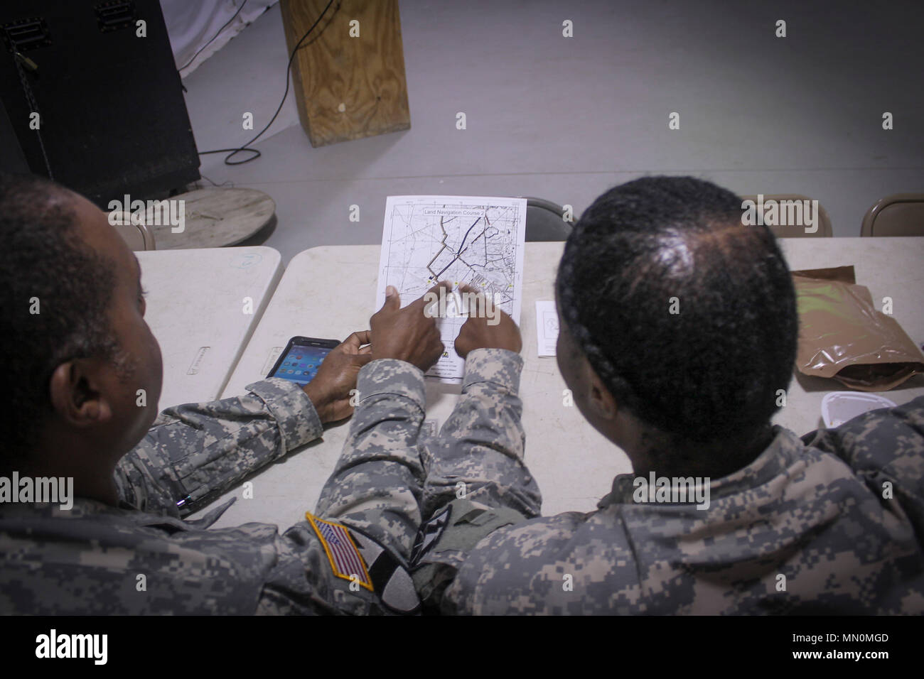 Two Army Reserve Soldiers from the 33th Signal Command (Theater) brush ...