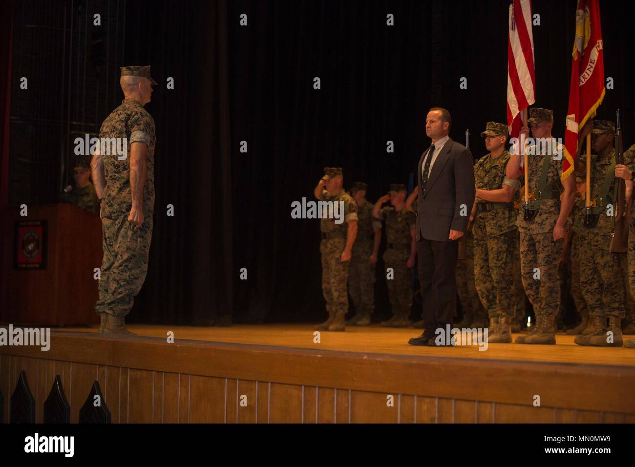 Retired U.S. Marine Corps Maj. Michael S. Seely stands at attention ...