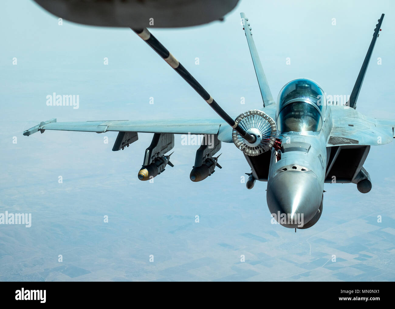 A U.S. Navy F/A-18 Super Hornet receives fuel from a KC-10 Extender ...