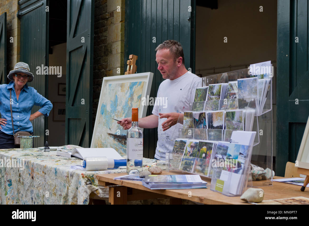 Local artist Chris Prout giving a demonstration of how he creates a ...