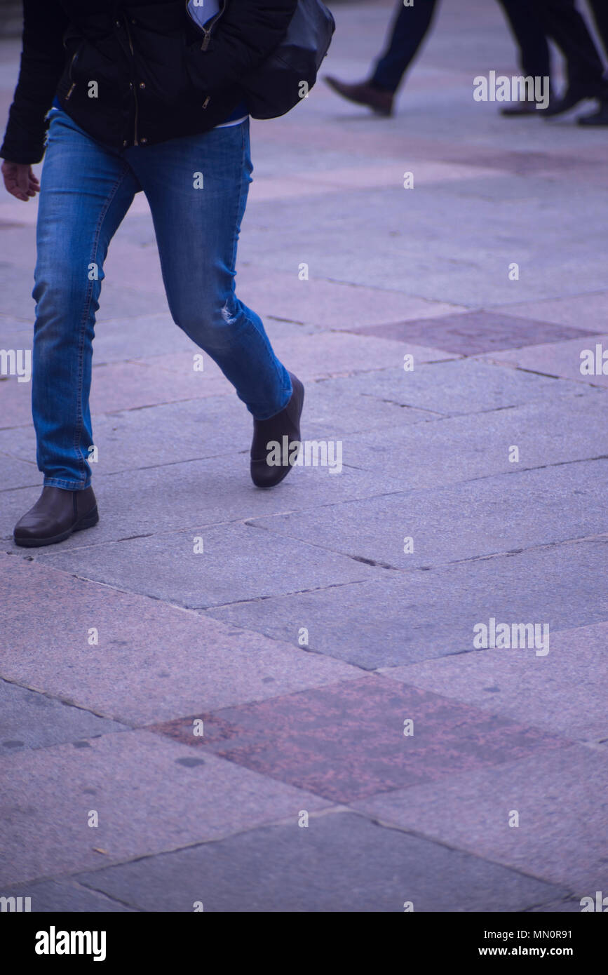 People walking in busy urban city shopping street sidewalk pavement ...