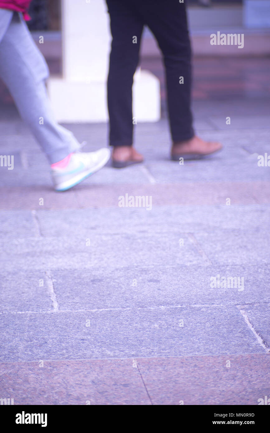 People walking in busy urban city shopping street sidewalk pavement ...
