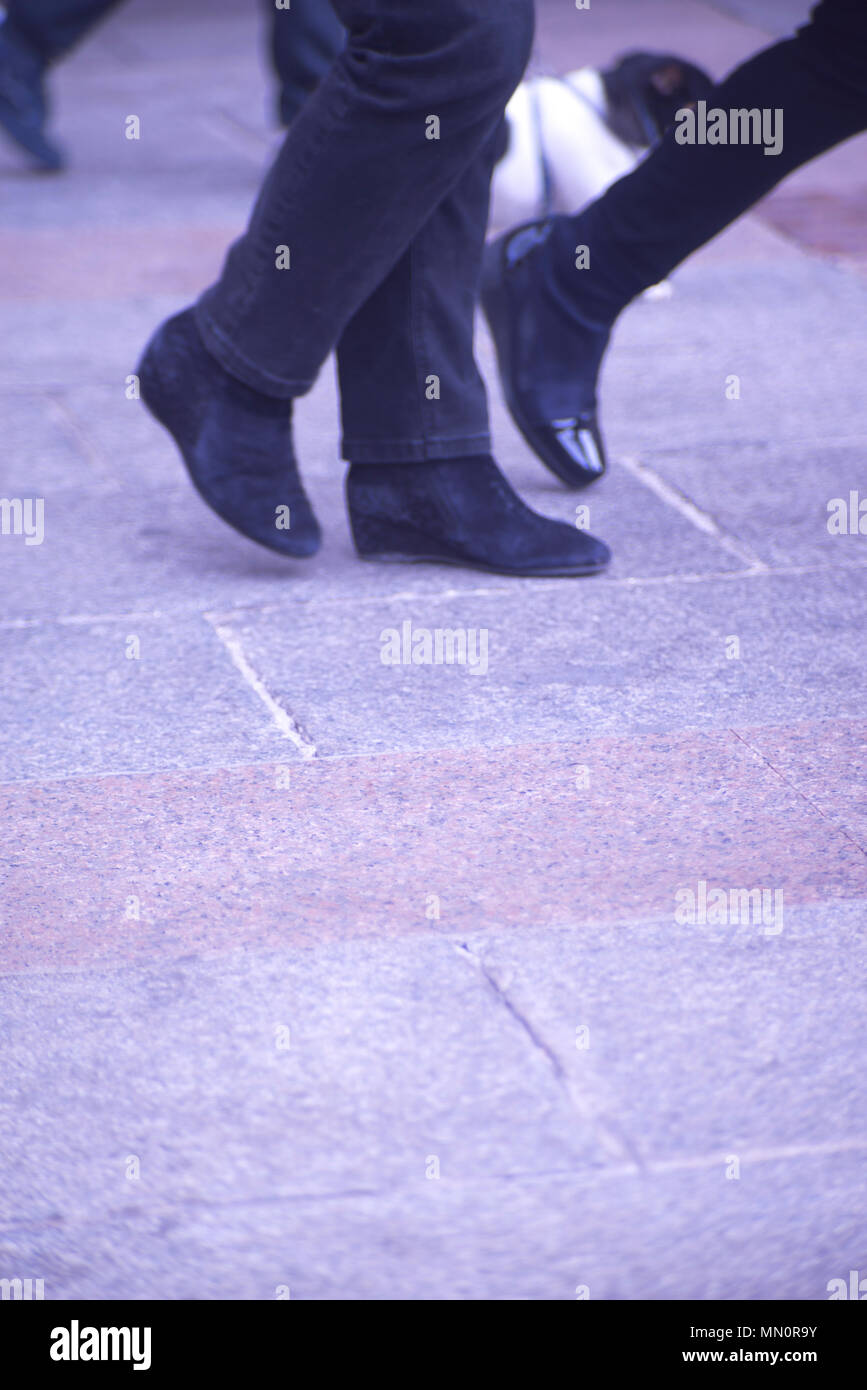 People walking in busy urban city shopping street sidewalk pavement ...