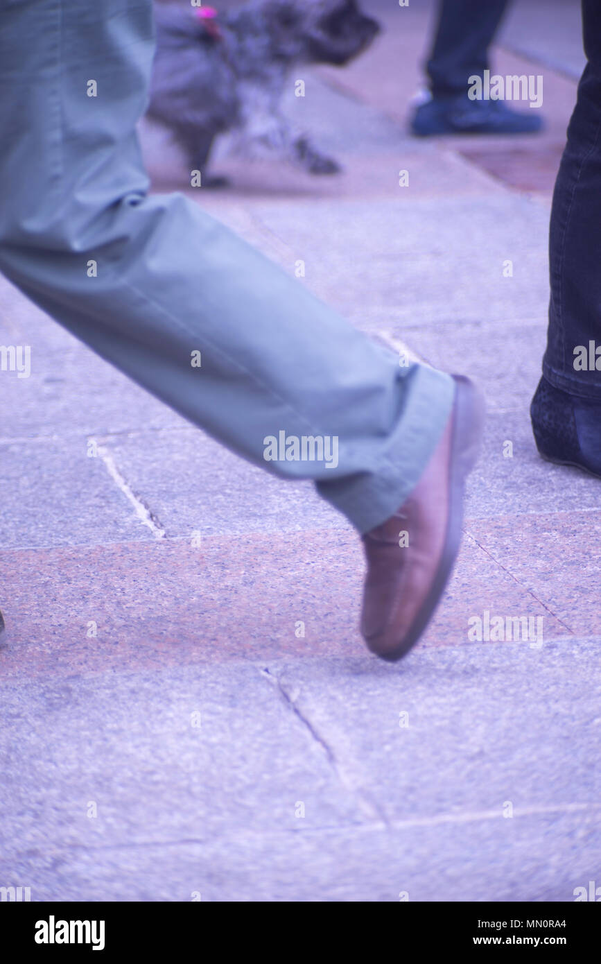 People walking in busy urban city shopping street sidewalk pavement ...