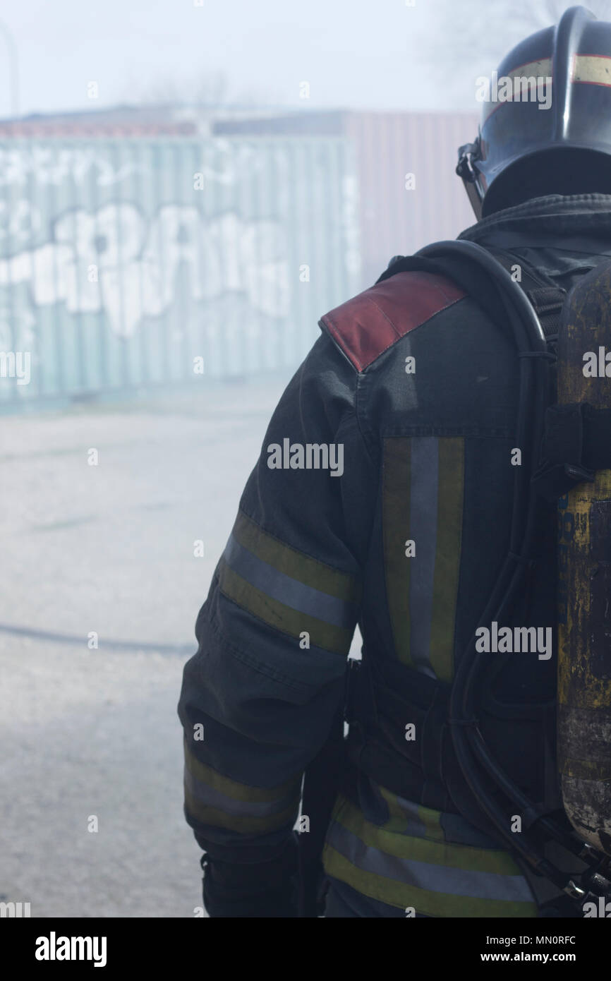 Firefighter putting out fire training station extinguisher backdraft ...