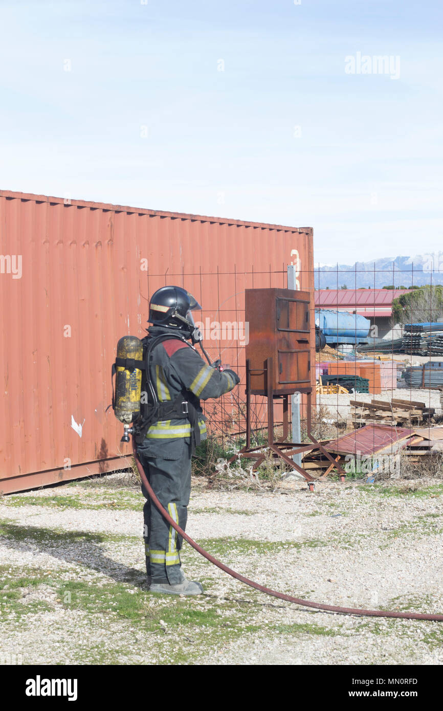 Firefighter putting out fire training station extinguisher backdraft ...