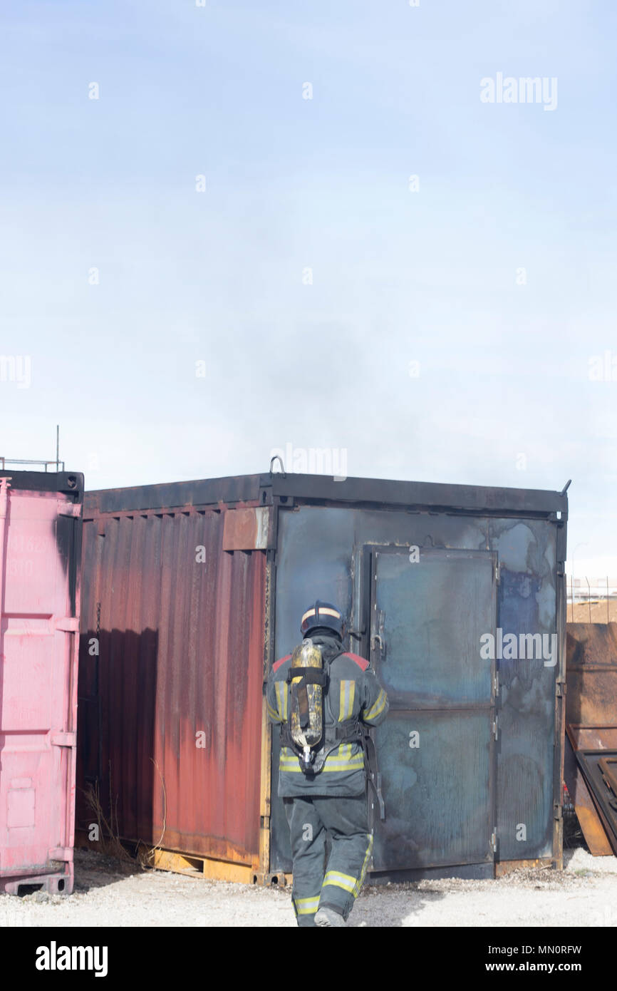 Firefighter putting out fire training station extinguisher backdraft ...