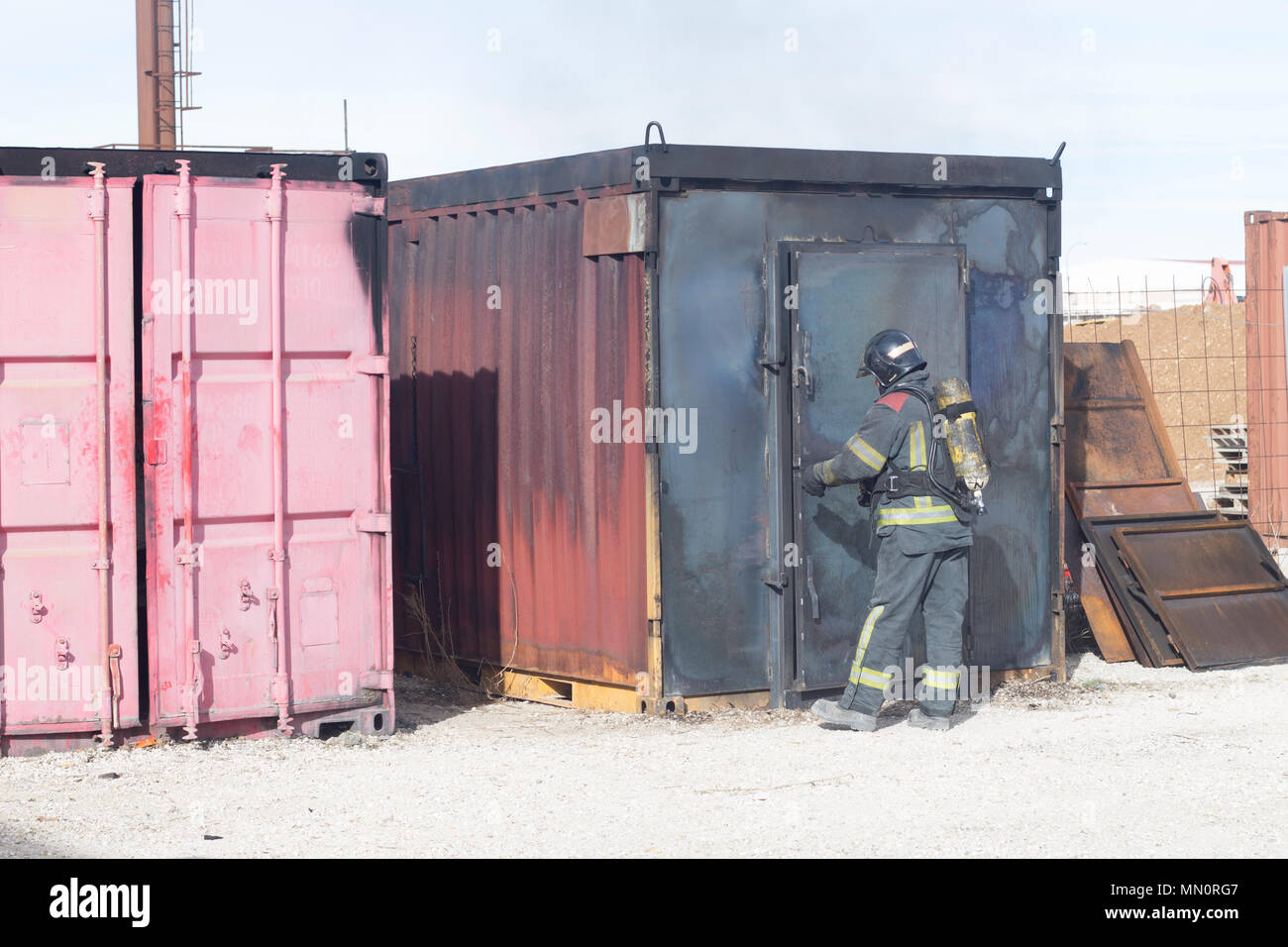 Firefighter putting out fire training station extinguisher backdraft ...