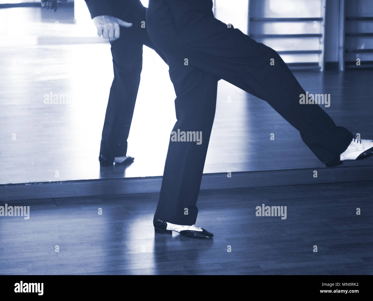 Ballroom dance male dancer and teacher in studio school dancing in ...