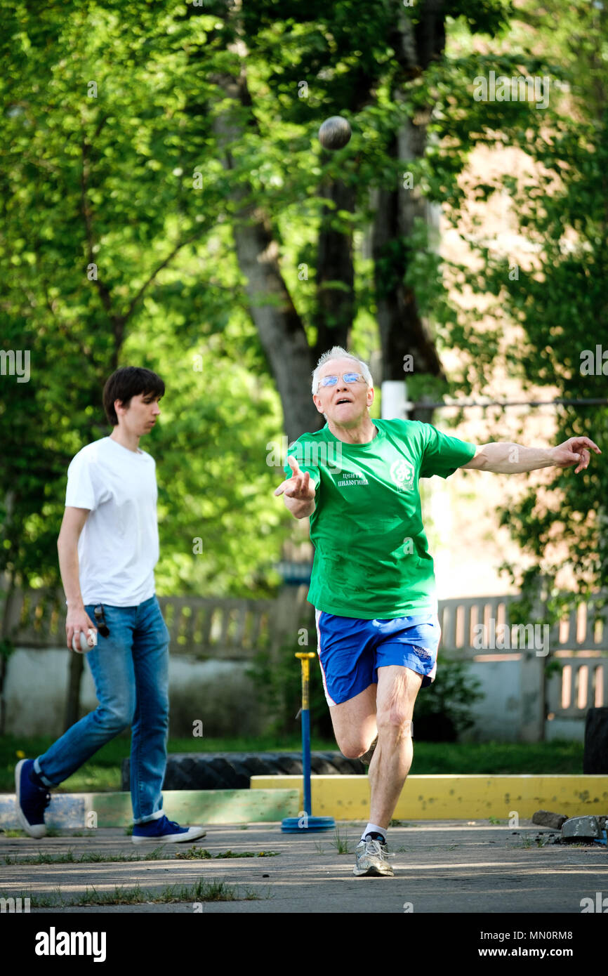 Russian athlete Mikhail Popov throws a metal ball for bocce volo Stock ...