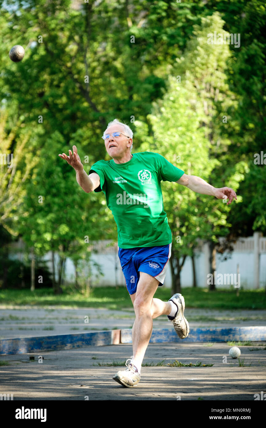 Russian athlete Mikhail Popov throws a metal ball for bocce volo Stock ...