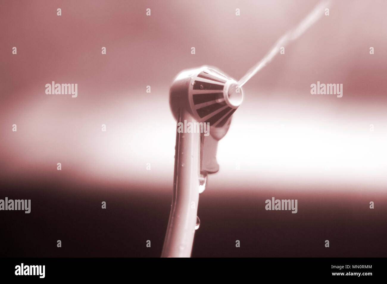 Dental water spray cleaner for interdental hygiene Stock Photo - Alamy