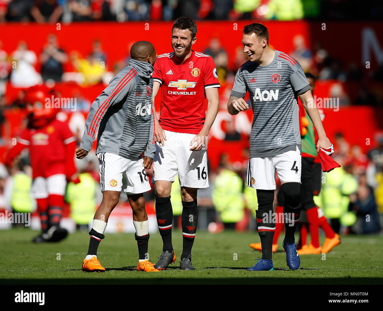 Manchester United's Michael Carrick (centre) with Ashley Young (left ...